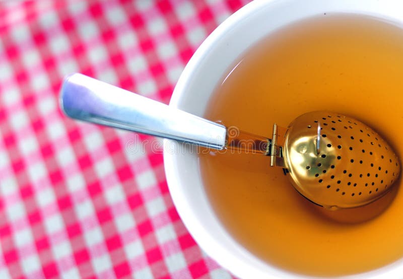 Brewing Tea, Spoon with Tea Leaves and Cup of Tea Stock Photo - Image ...