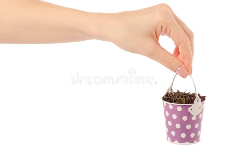 Tea in a bucket in hand stock image. Image of fresh - 107093947
