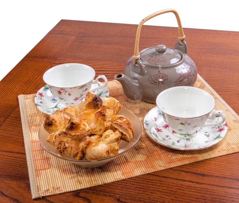 Cups of tea and buns stock image. Image of dessert, oclock - 32881595