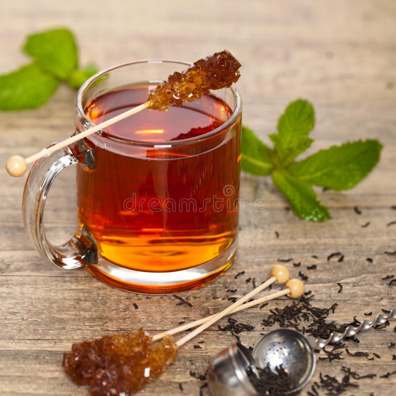Tea with Candy Brown Sugar on a Sticks Stock Image - Image of spearmint ...