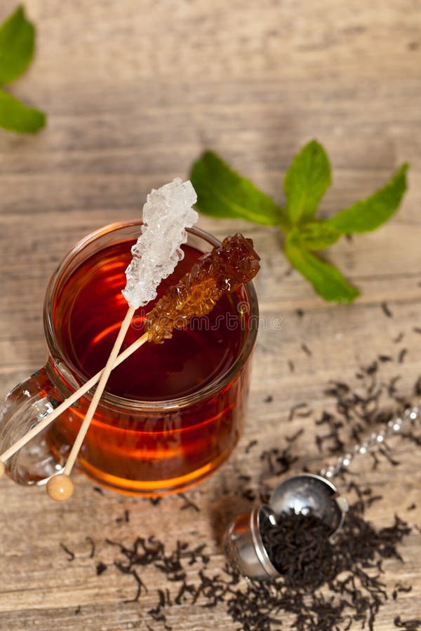 Tea with Candy Brown Sugar on a Sticks Stock Photo - Image of spearmint ...