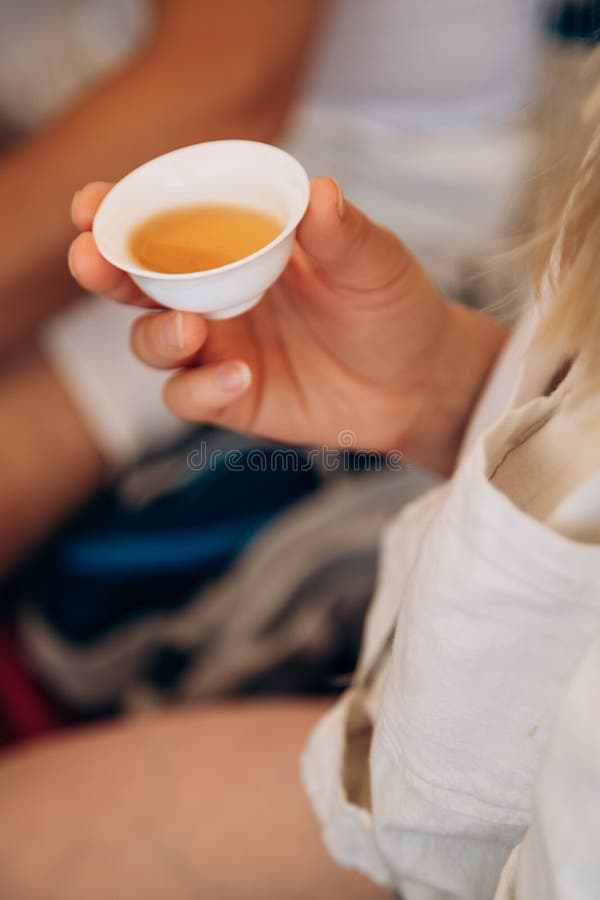 Tea Ceremony. the Hand Holds a White Bowl for Tea. Ancient Traditions ...