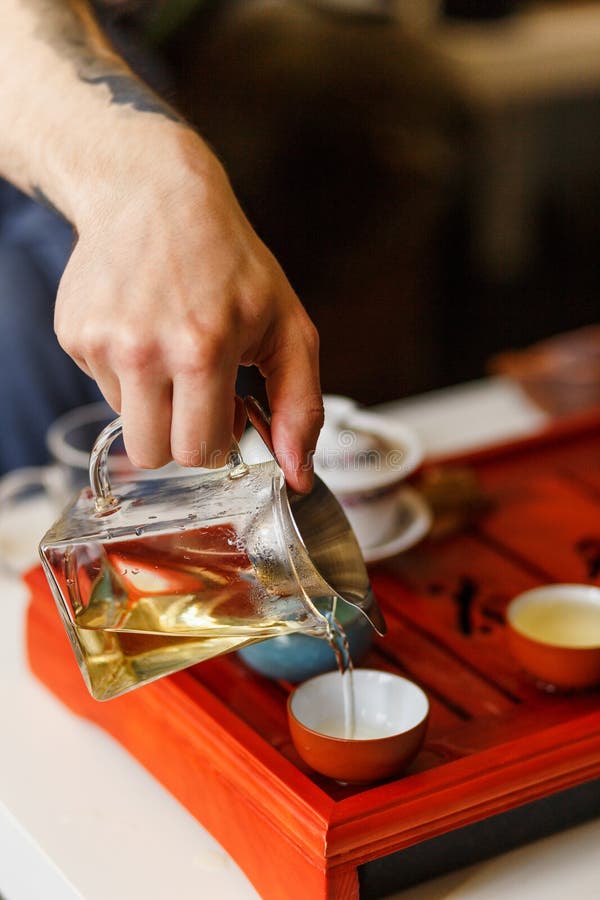 The Tea Ceremony. the Hands of Man Pouring Tea. Stock Photo - Image of ...