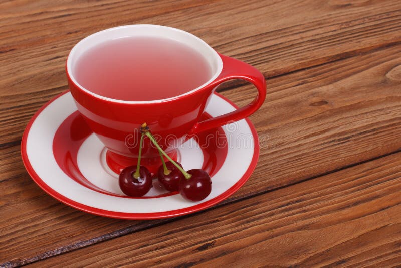 Tea with Cherry Berries on Brown Wooden Table Stock Photo - Image of ...