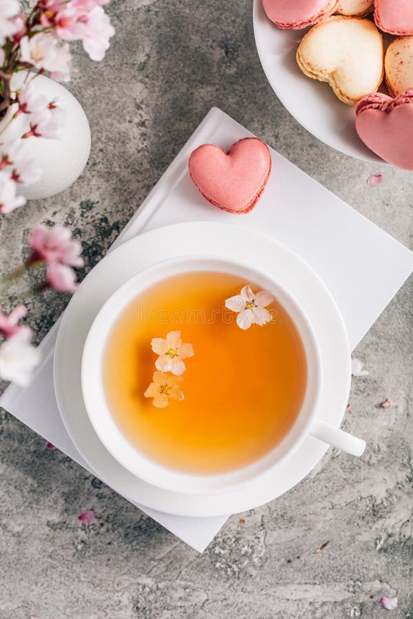 Tea with Cherry Blossom Petals - Sakura Tea in White Cup Stock Photo ...