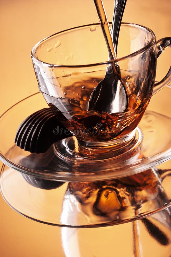 Tea with chocolate candy stock image. Image of glass - 25986745