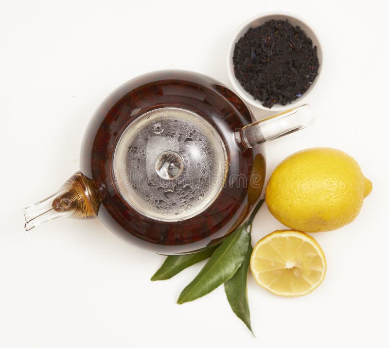 Tea Concept,Teapot and Cup of Tea with Green Leaves, Lemon, Top View ...