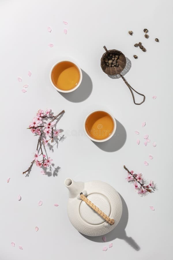 Tea Concept, Two White Cups of Tea and Teapot on Concrete Background ...