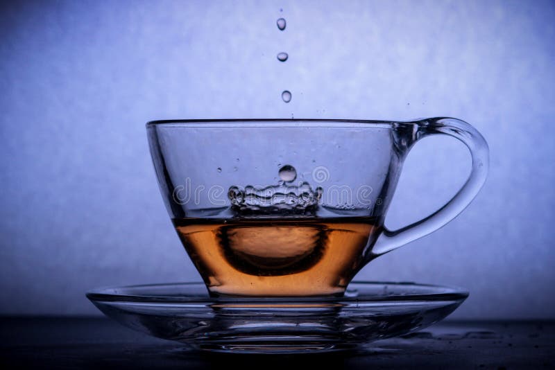 Tea Creating Splash in a Cup Stock Image - Image of greentea, color ...