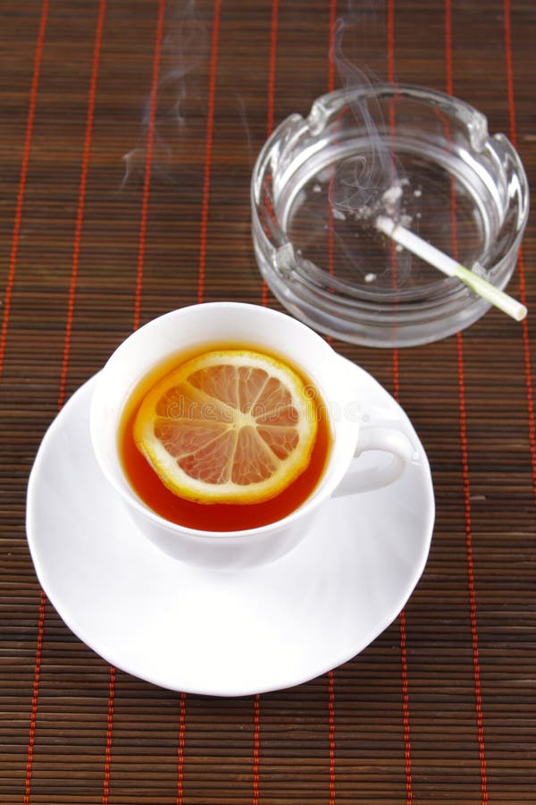 Tea Cup and Ashtray with Cigarette Stock Image - Image of danger, rough ...
