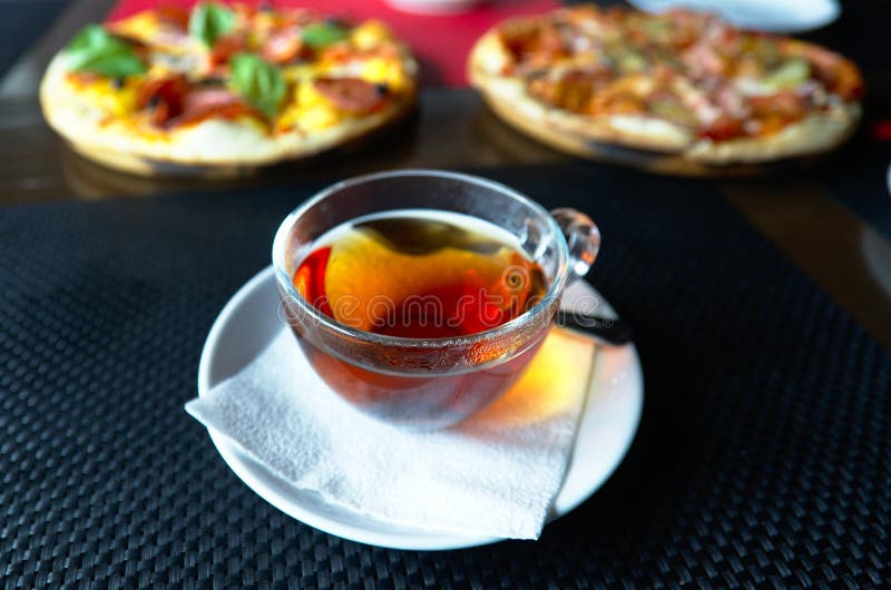 Tea Cup on Plate with Pizza Stock Image - Image of black, rustic: 155400329