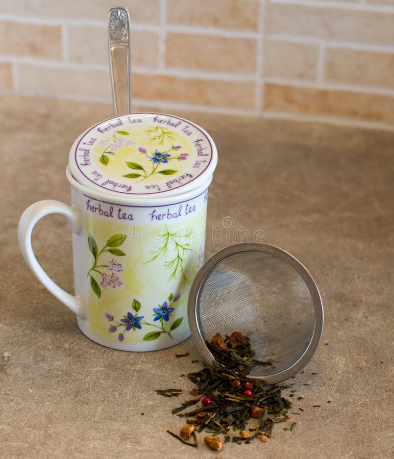 Tea Cup with Spoon and Strainer Stock Image - Image of close, brown ...