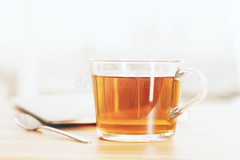 Tea cup and spoon stock photo. Image of morning, food - 69999620