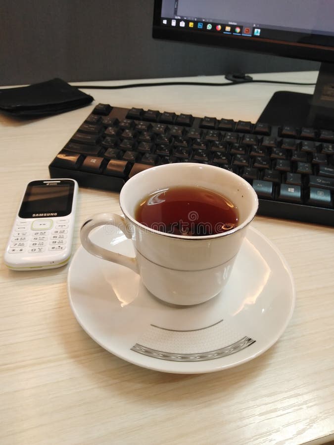 Tea Cup with Tea on the Table in Office. Stock Image - Image of saucer ...