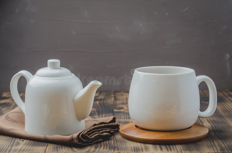 Tea. Cup of Tea and Teapot. White Ware on a Wooden Table Stock Image ...