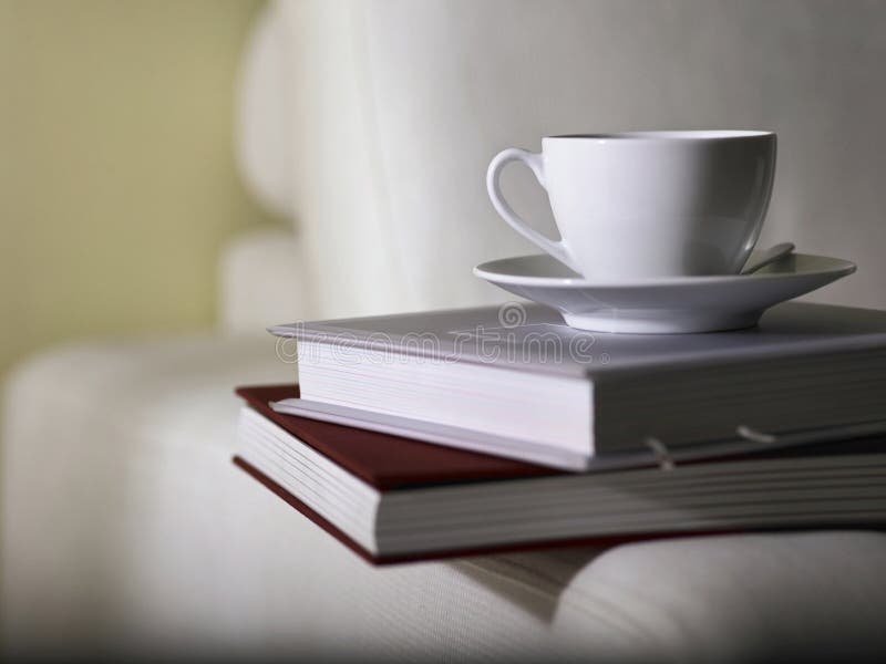 Tea cup and books stock photo. Image of healthy, couch - 18250424