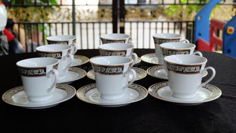Tea cups on the plate stock photo. Image of table, arranged - 68434672