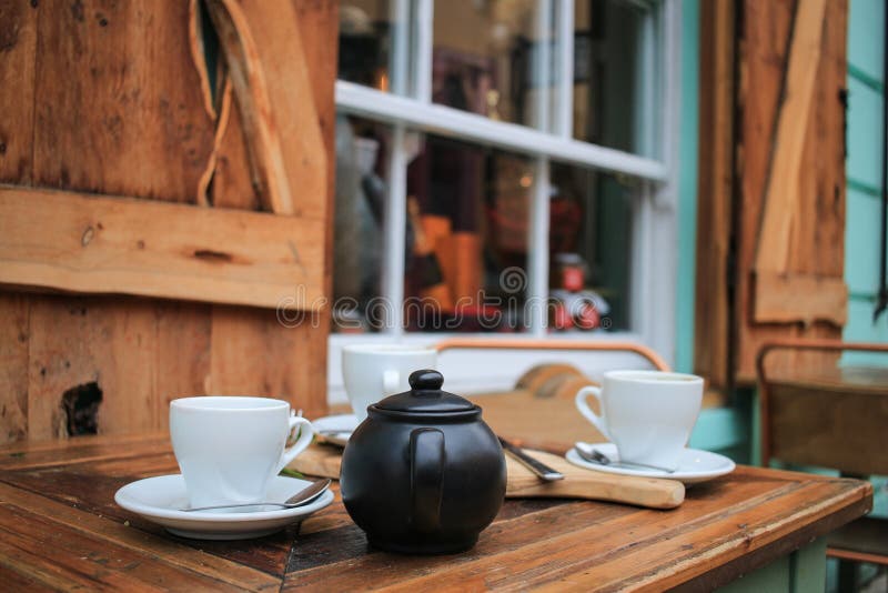 Tea Cups and Teapot on a Table at an Outside Cafe. Stock Photo - Image ...