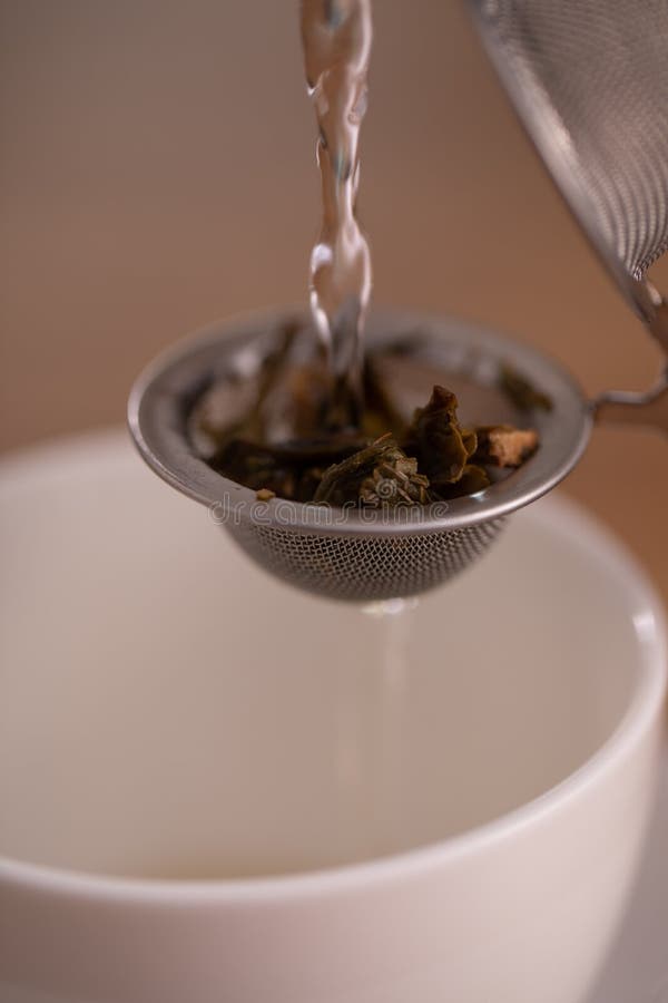 Tea Diffuser Close Up To Texture of Tea Leaf Ingredient with Pouring ...