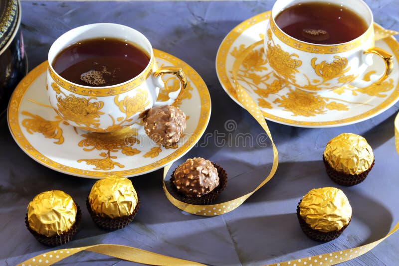 Tea Drinking. Tea Ceremony. Two Cups of Tea and a Chocolate Candy ...