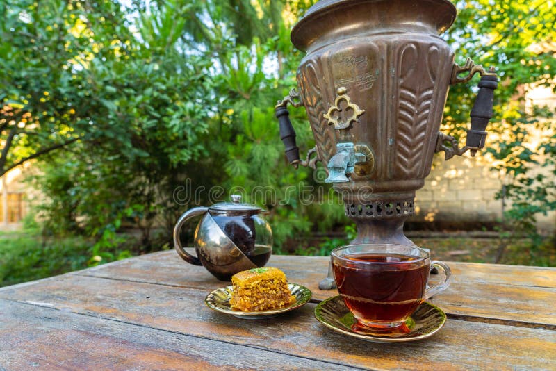 Tea Drinking from a Vintage Samovar with Oriental Sweets Stock Image ...