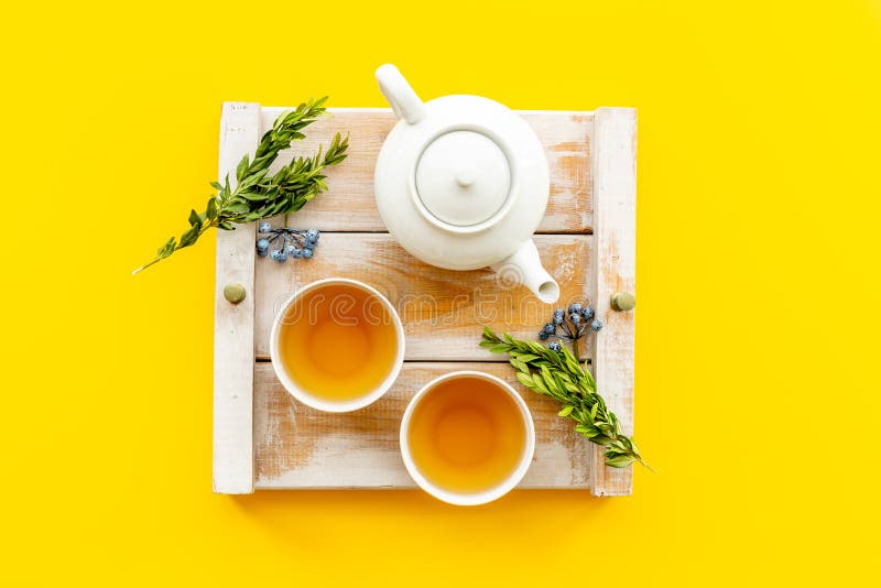 Tea Drinking with White Teapot and Two Cups with Green Leaves, Top View ...