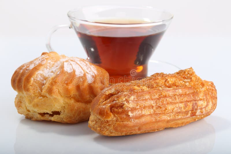 Tea with Eclair and Profiterole Stock Image - Image of caramel, drink ...
