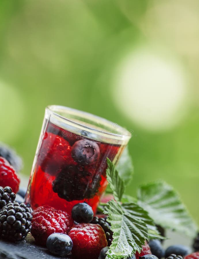 Tea with Forest Berries on a Green Natural Background, Selective Stock ...