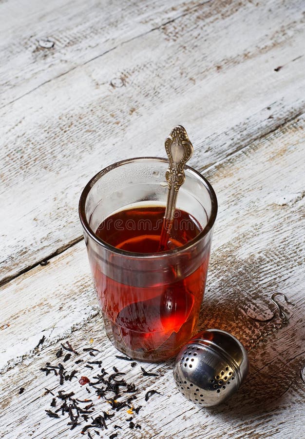 Tea in glass and strainer stock photo. Image of glass - 51406202