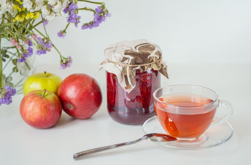 Tea, Jar of Raspberry Jam and Apples on White Table. Stock Image ...