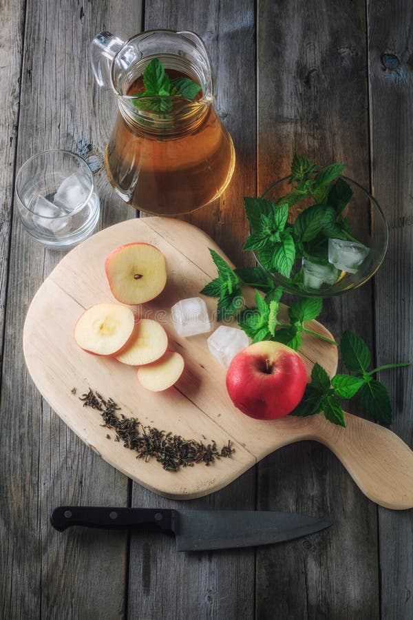 Tea in a Jar and Sliced Apples on a Cutting Board Stock Photo - Image ...