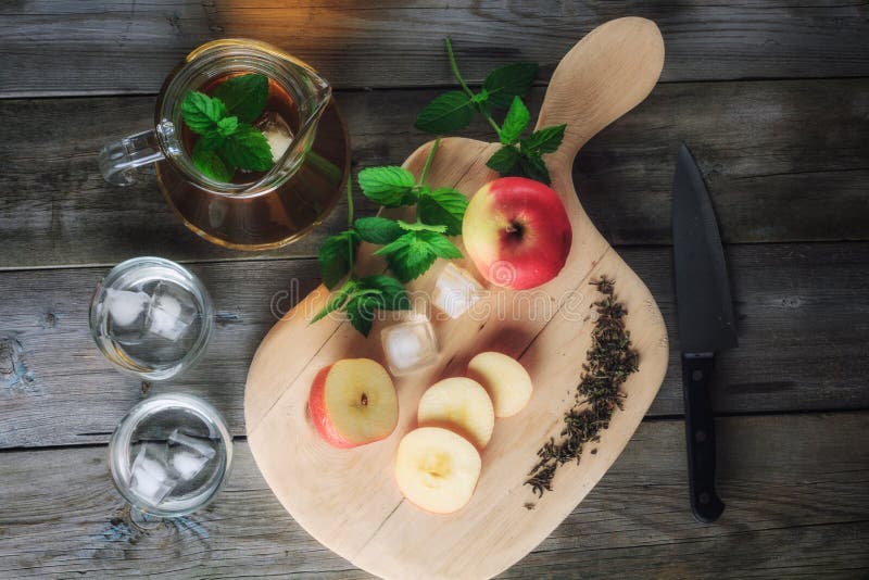 Tea in a Jar and Sliced Apples on a Cutting Board Stock Image - Image ...