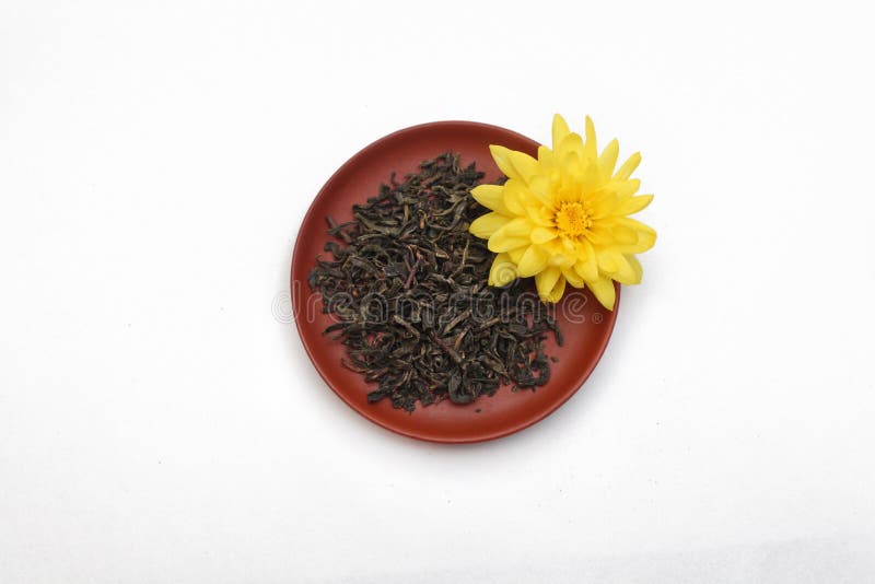 Tea Leaves with Yellow Flower on Ceramic Saucer Stock Image - Image of ...