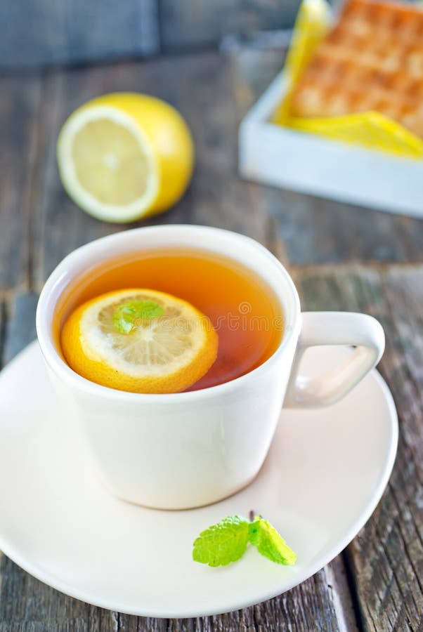 Tea with lemon and waffle stock photo. Image of lunch - 51454814