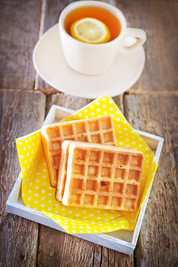 Tea with lemon and waffle stock image. Image of food - 51454873