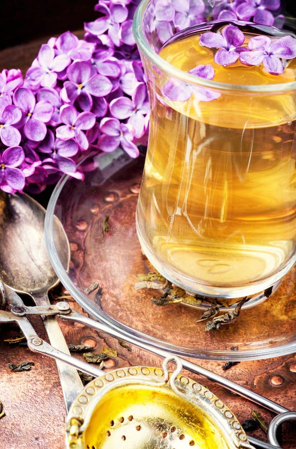 Tea with lilac flavor stock image. Image of blooming - 115983777