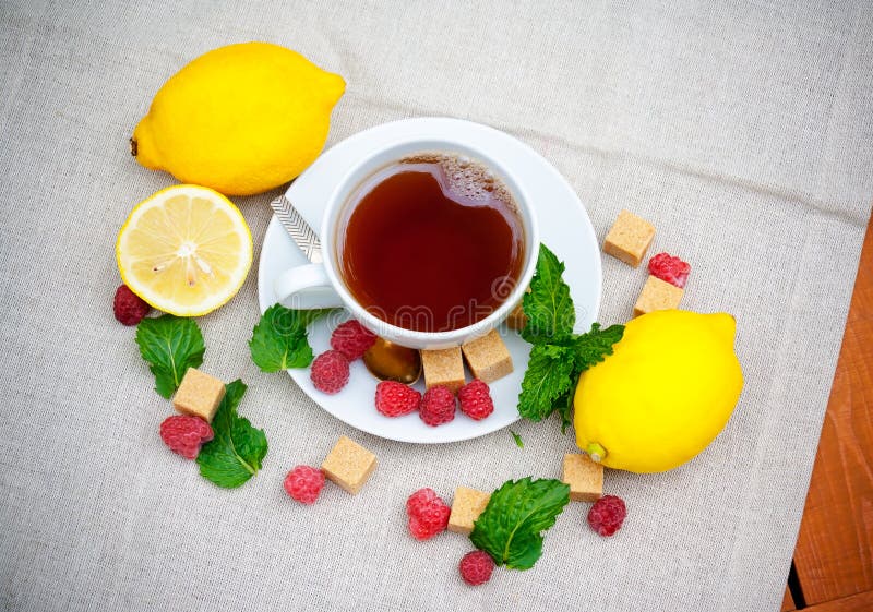Tea with Mint, Brown Sugar, Raspberry and Lemon Stock Image - Image of ...