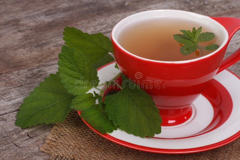 Tea with Mint in a Red Cup on Old Wooden Stock Image - Image of ...