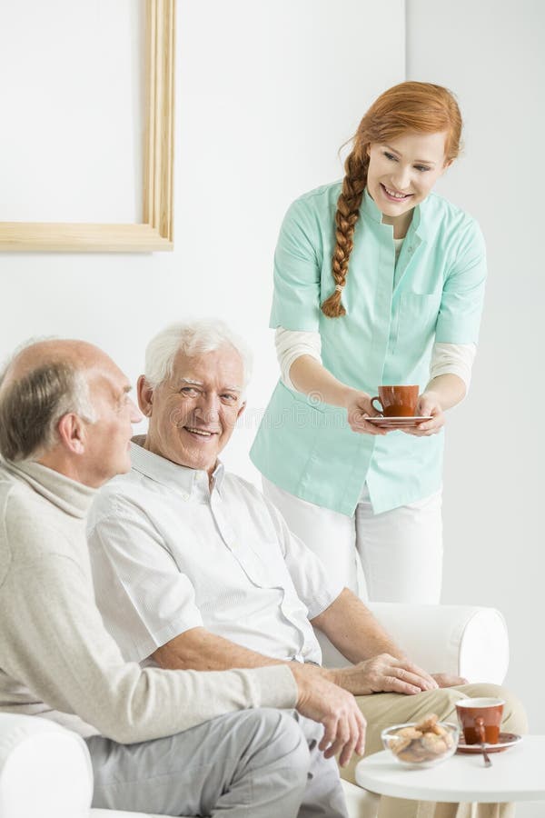 Nurse Holding Hand of Senior Man in Rest Home Stock Image - Image of ...