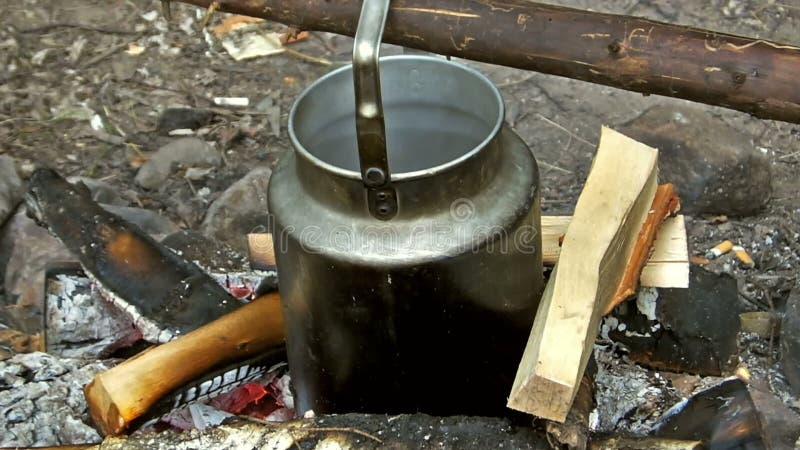 Tea on an open fire stock footage. Video of flame, smoke - 65574520