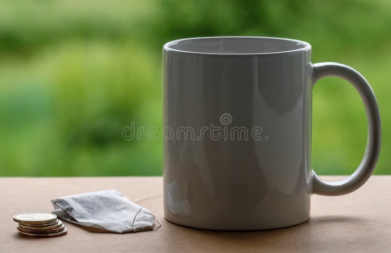Tea Package and a Mug with Coins Stock Image - Image of color, drink ...
