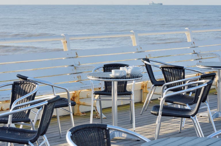 Tea on the pier stock image. Image of pier, chairs, tables - 70441837