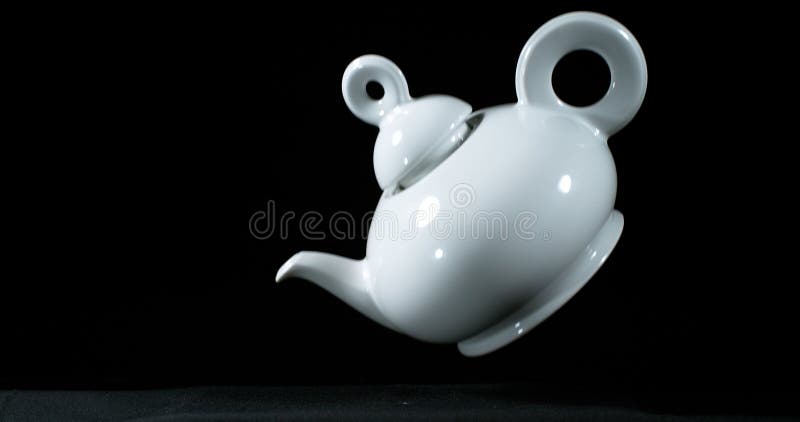Tea-Pot Falling on Black Background Stock Photo - Image of impact ...