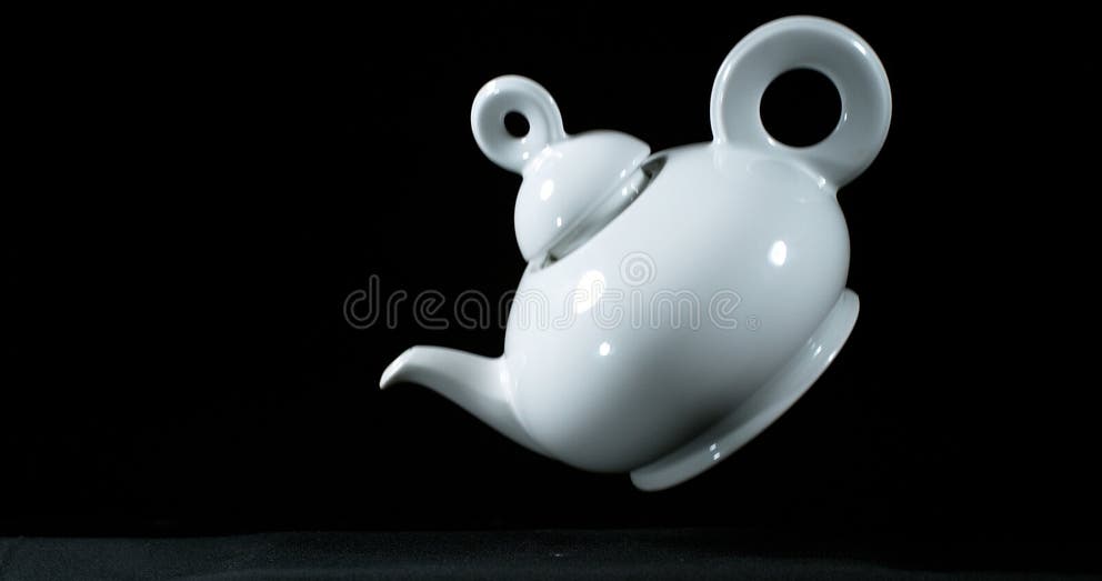 Tea-Pot Falling on Black Background Stock Photo - Image of impact ...