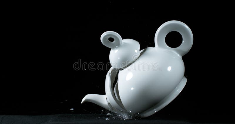 Tea-Pot Falling and Exploding on Black Background Stock Photo - Image ...