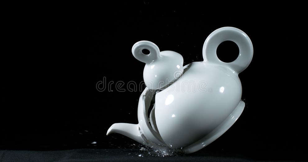 Tea-Pot Falling and Exploding on Black Background Stock Photo - Image ...