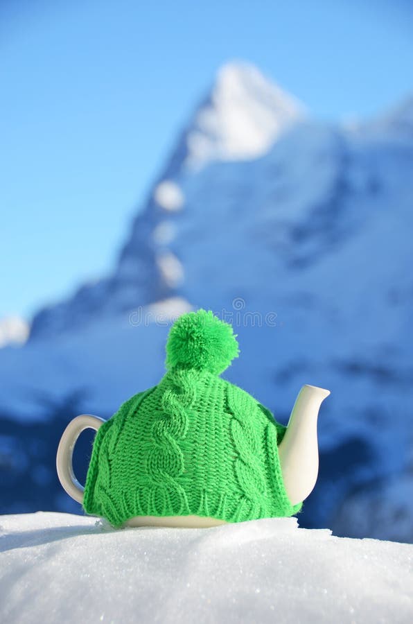 Tea pot in the knitted cap stock photo. Image of seasonal - 34451038