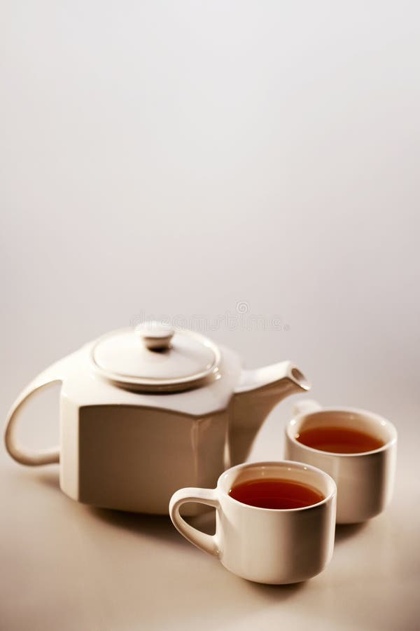 A Tea Pot and Two Cup of Tea Stock Photo - Image of indulgence, brown ...