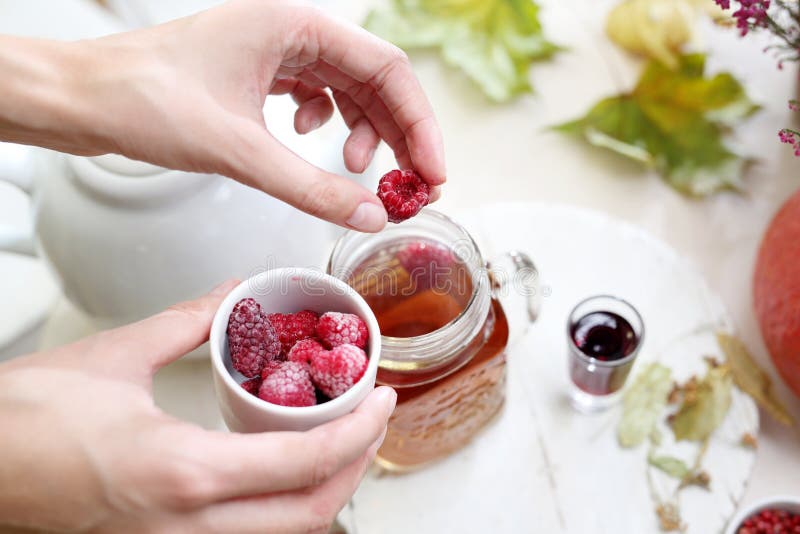 Tea with raspberries. stock photo. Image of cafe, dried - 128913078