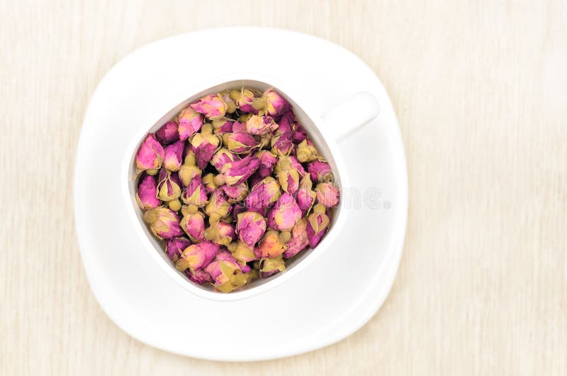 Tea Roses in a White Cup on Wooden Table Stock Photo - Image of color ...